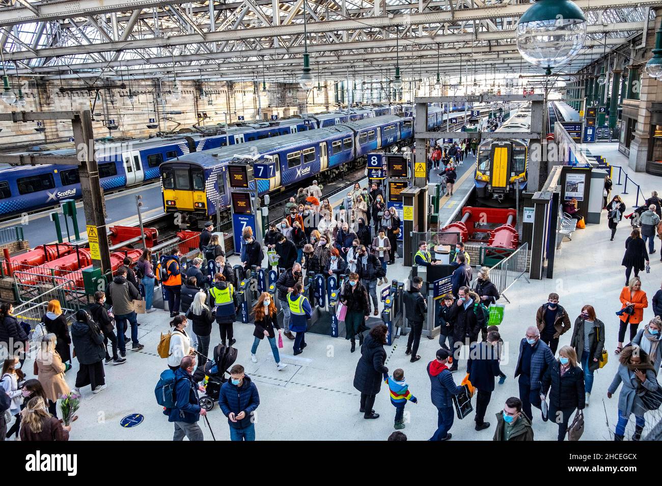 Commuters traveling on trains and in busy railway stations Stock Photo ...
