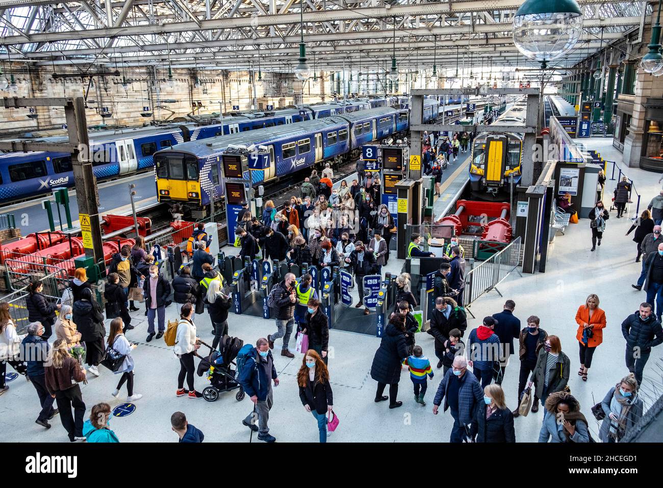 Commuters traveling on trains and in busy railway stations Stock Photo ...