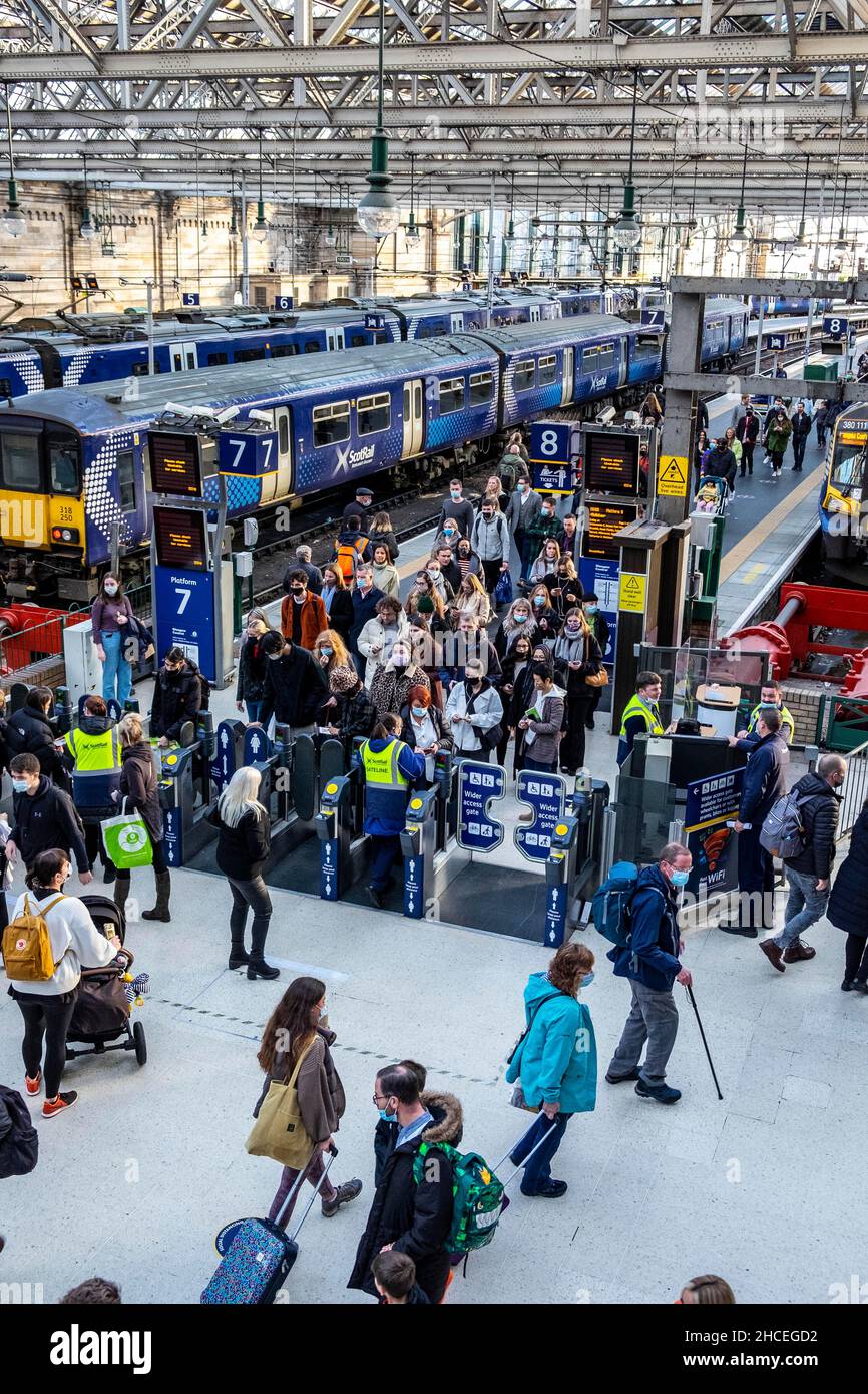 Commuters traveling on trains and in busy railway stations Stock Photo ...