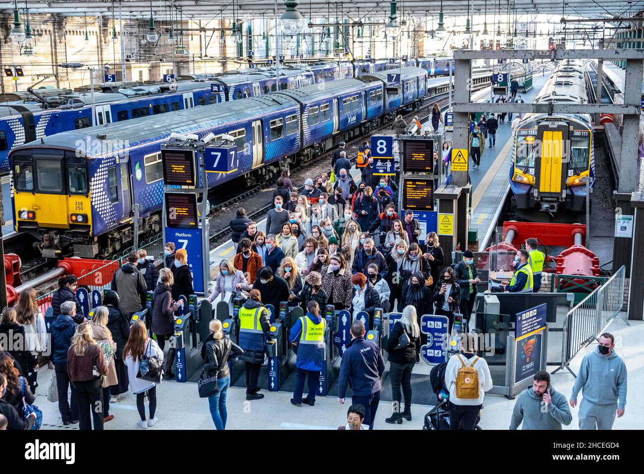 Commuters traveling on trains and in busy railway stations Stock Photo ...