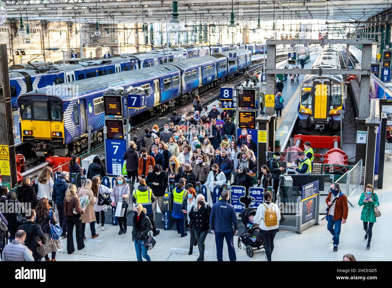 Commuters traveling on trains and in busy railway stations Stock Photo ...