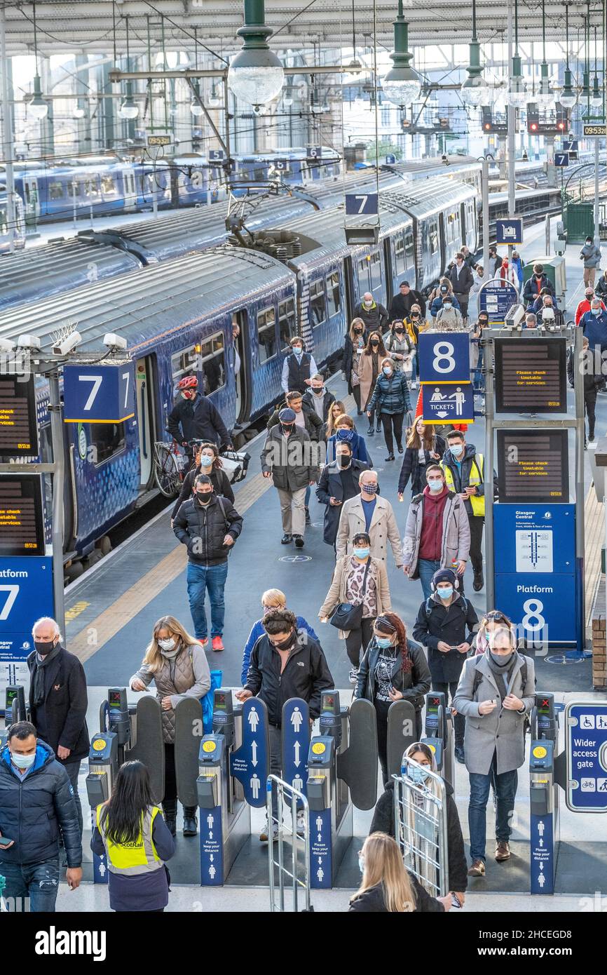 Commuters traveling on trains and in busy railway stations Stock Photo ...