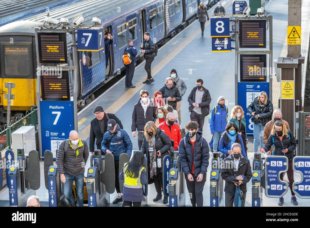 Commuters traveling on trains and in busy railway stations Stock Photo ...