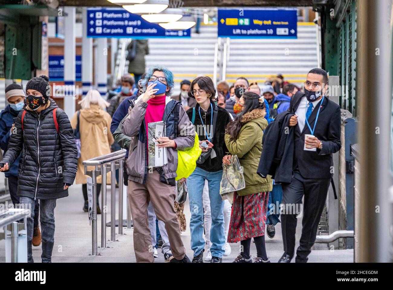 Commuters traveling on trains and in busy railway stations Stock Photo ...