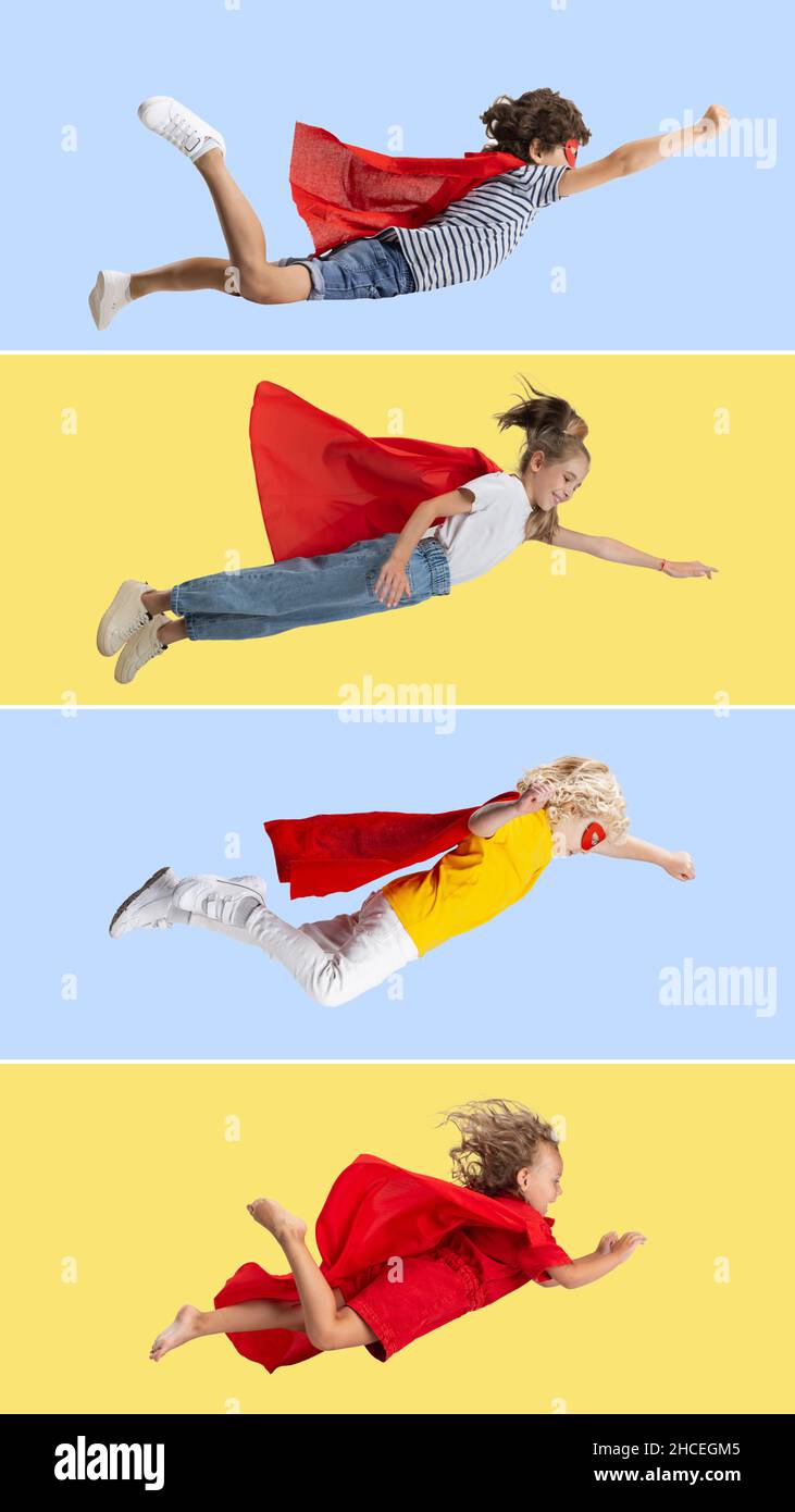 Collage of cheerful children, boys and girls, in red mantle flying like a superhero isolated ...