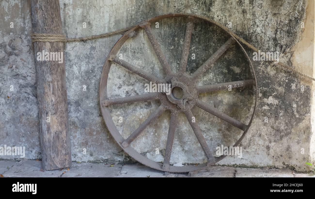 Old and Rusty Wagon wheel in the Yucatan Haciendas Stock Photo - Alamy