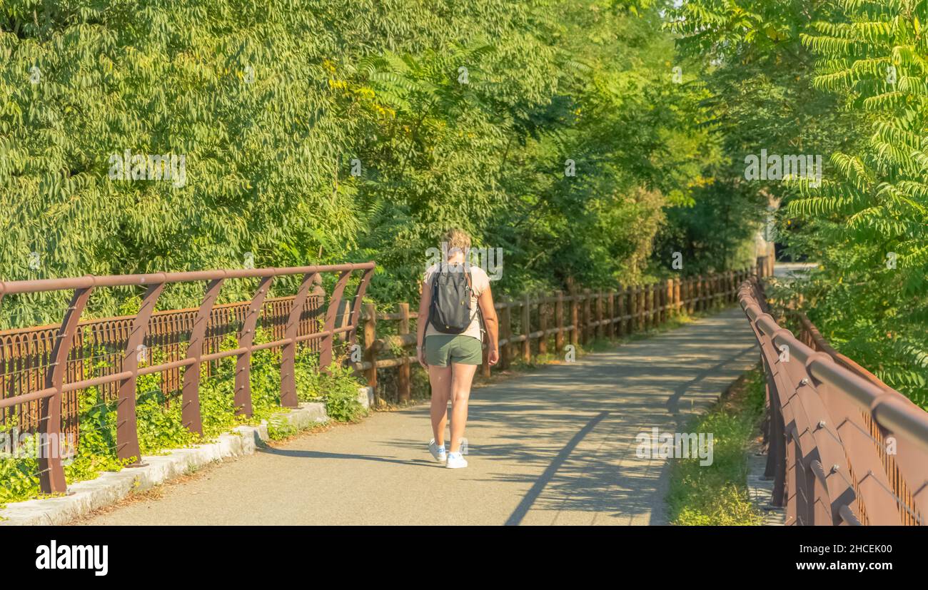 Bike path with one person Stock Photo - Alamy