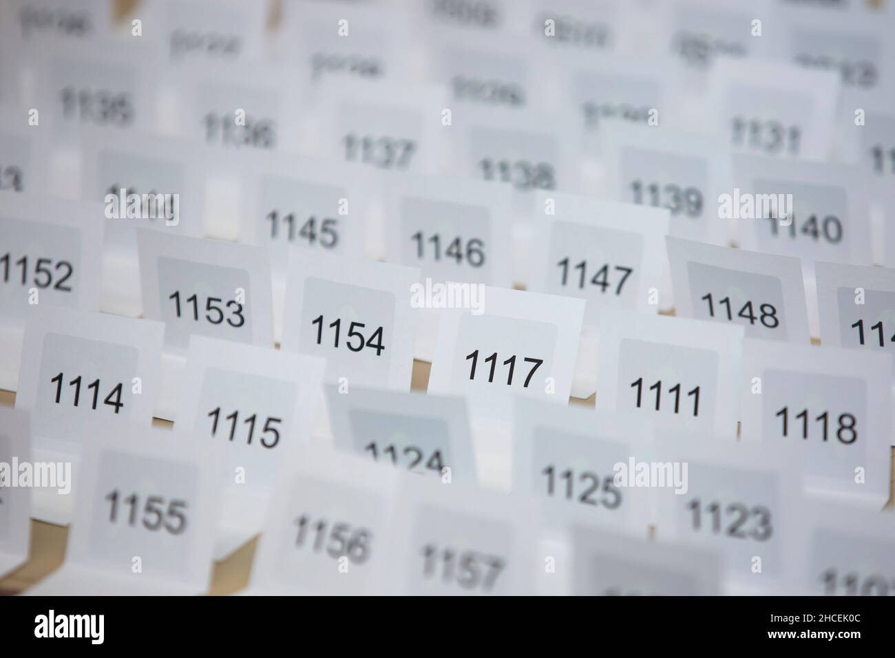 Different numbers printed on sheets of papers organized in a row Stock ...