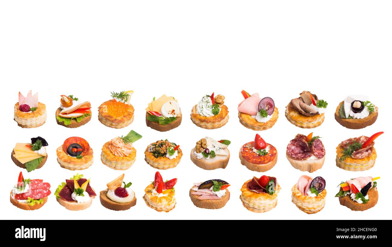 Canapes with different berries and toppings isolated on a white ...