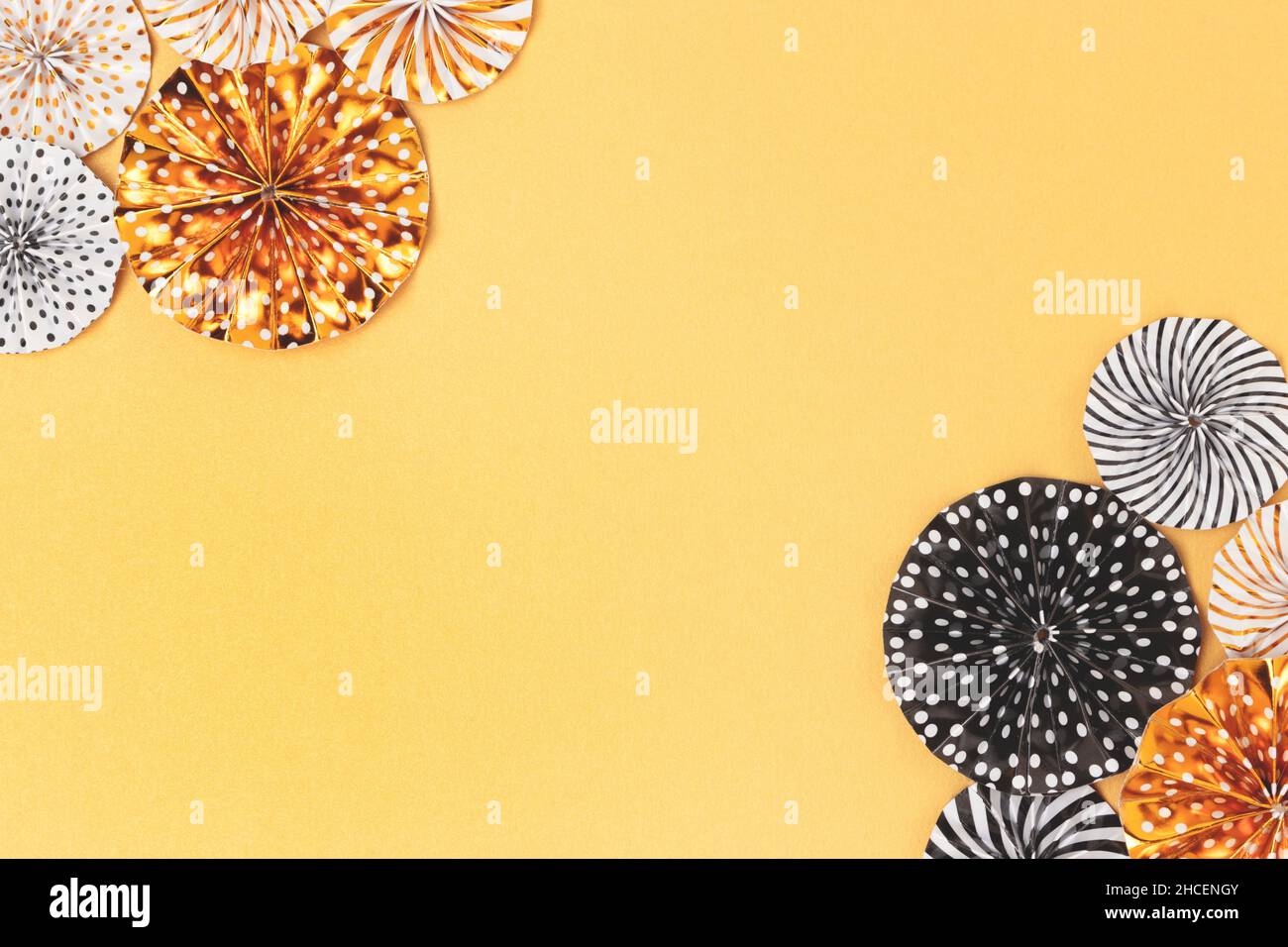 Border frame made of colorful paper fans on a golden background Stock ...