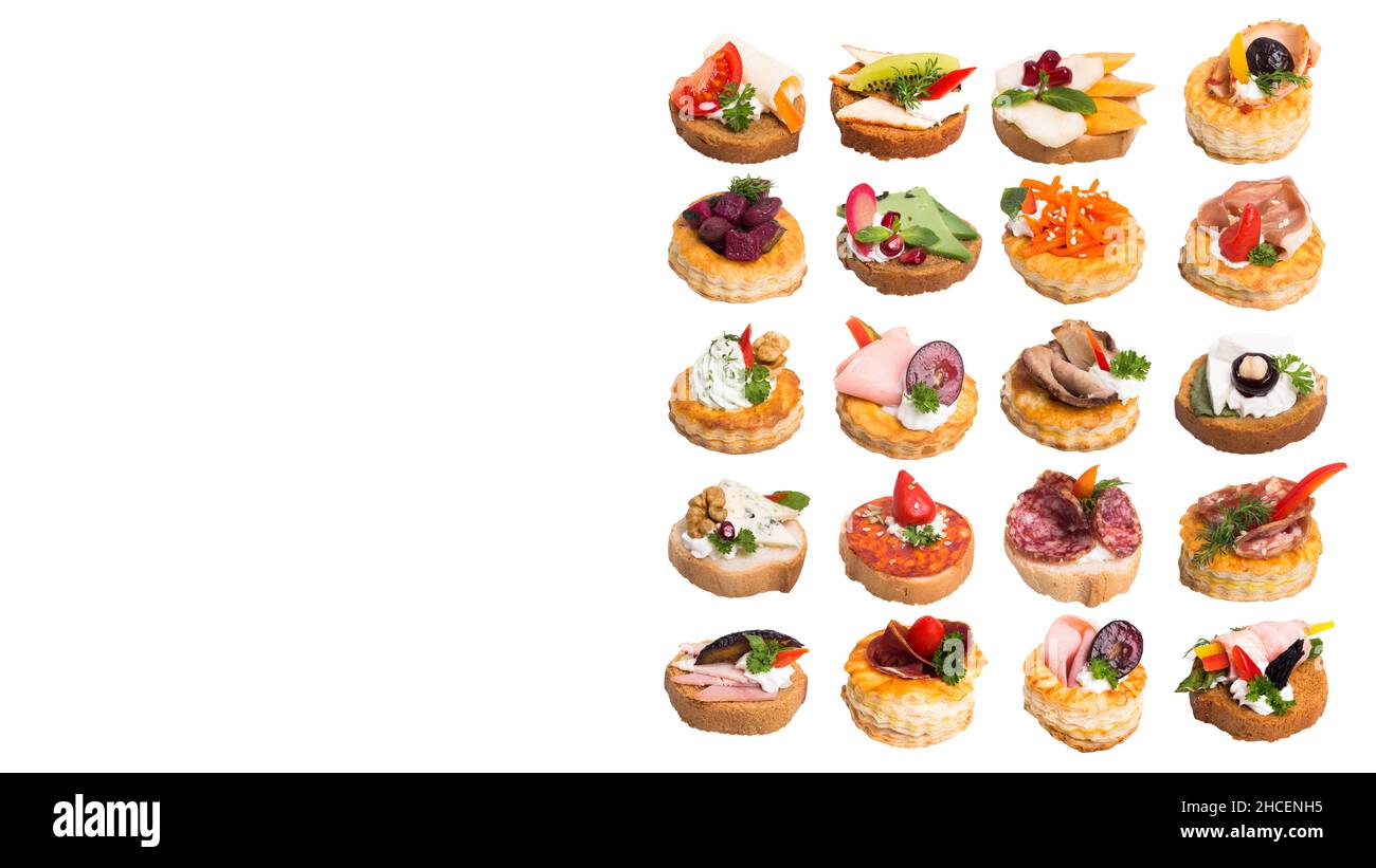 Canapes with different berries and toppings isolated on a white ...