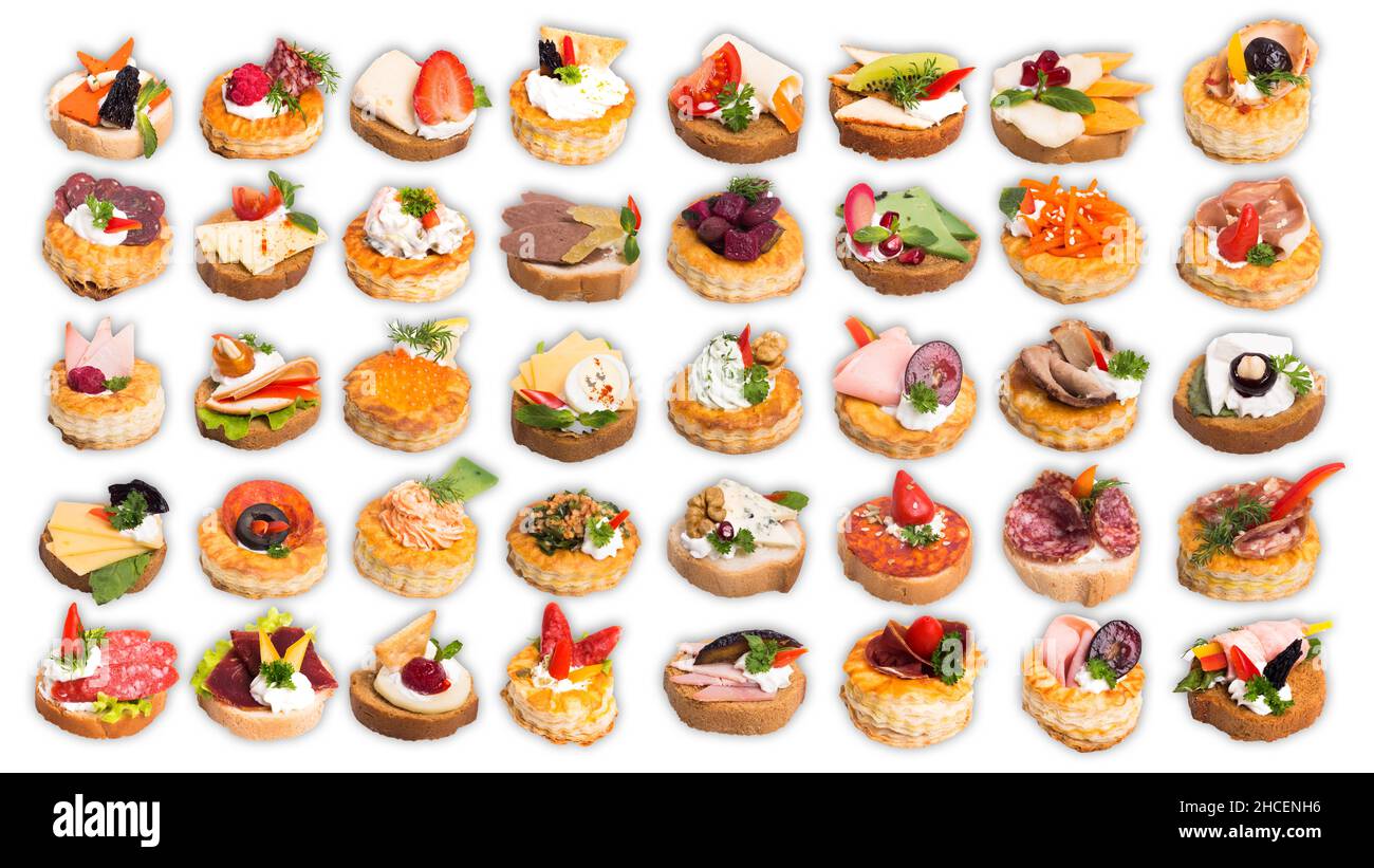 Canapes with different berries and toppings isolated on a white ...