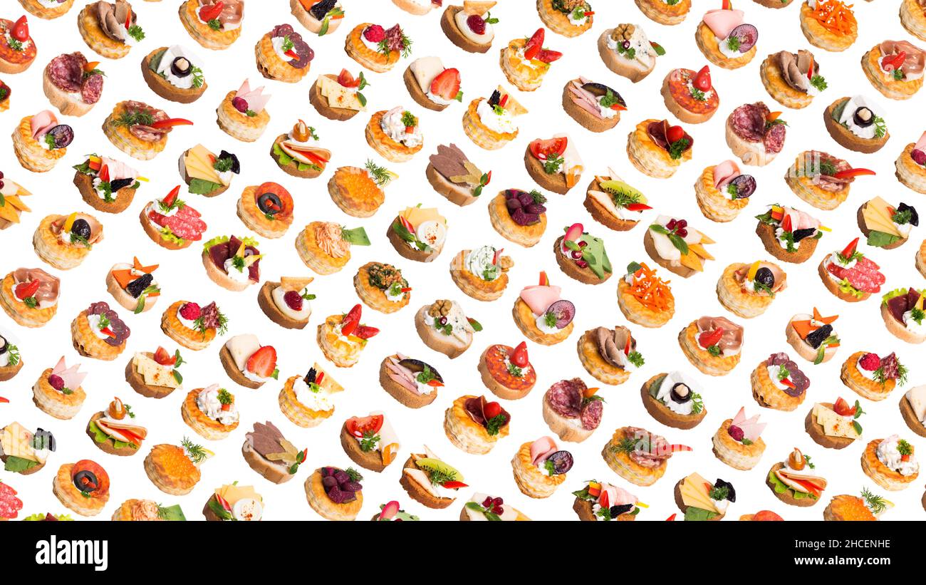 Canapes with different berries and toppings isolated on a white ...