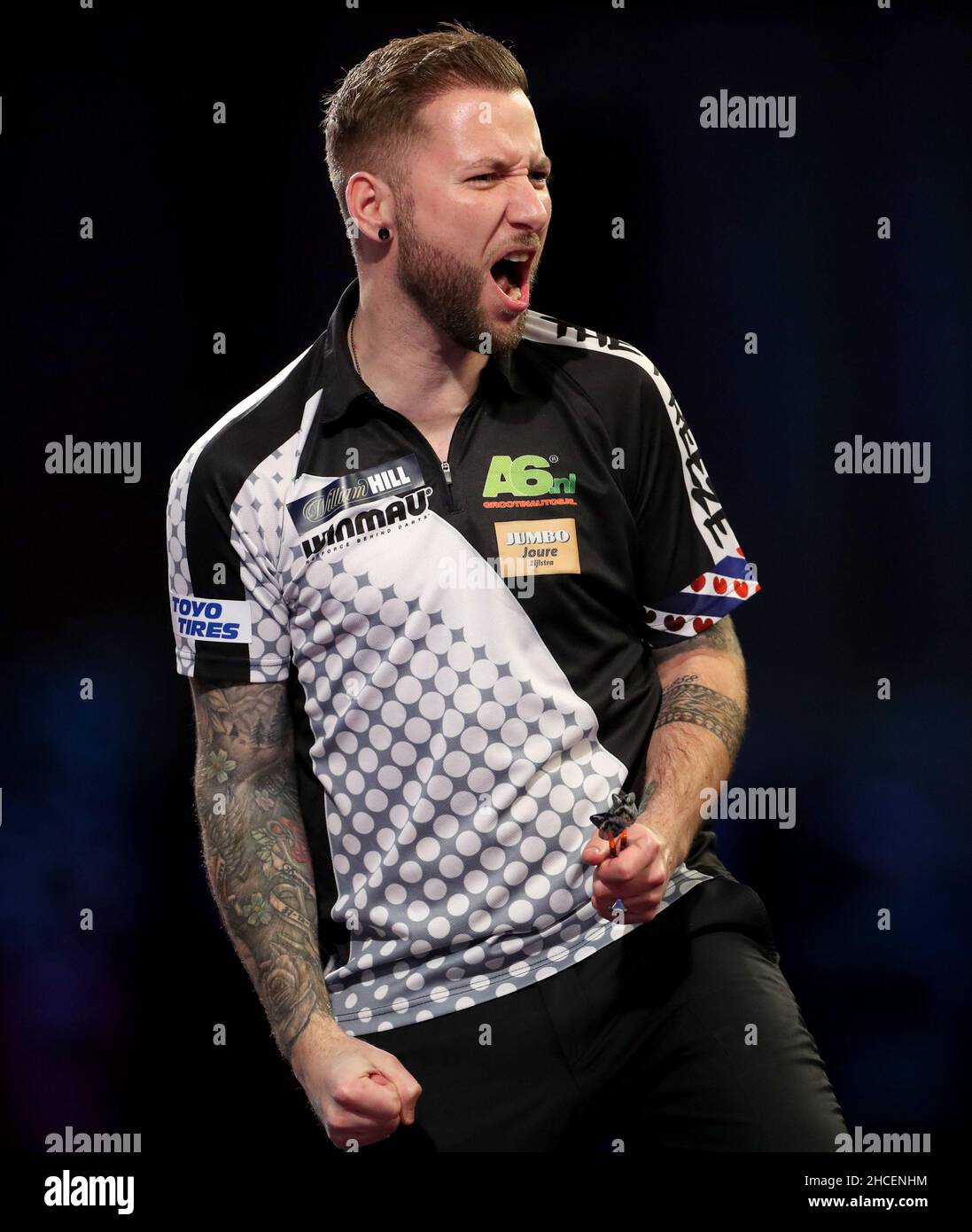 Danny Noppert celebrates against Ryan Searle during day eleven of the ...