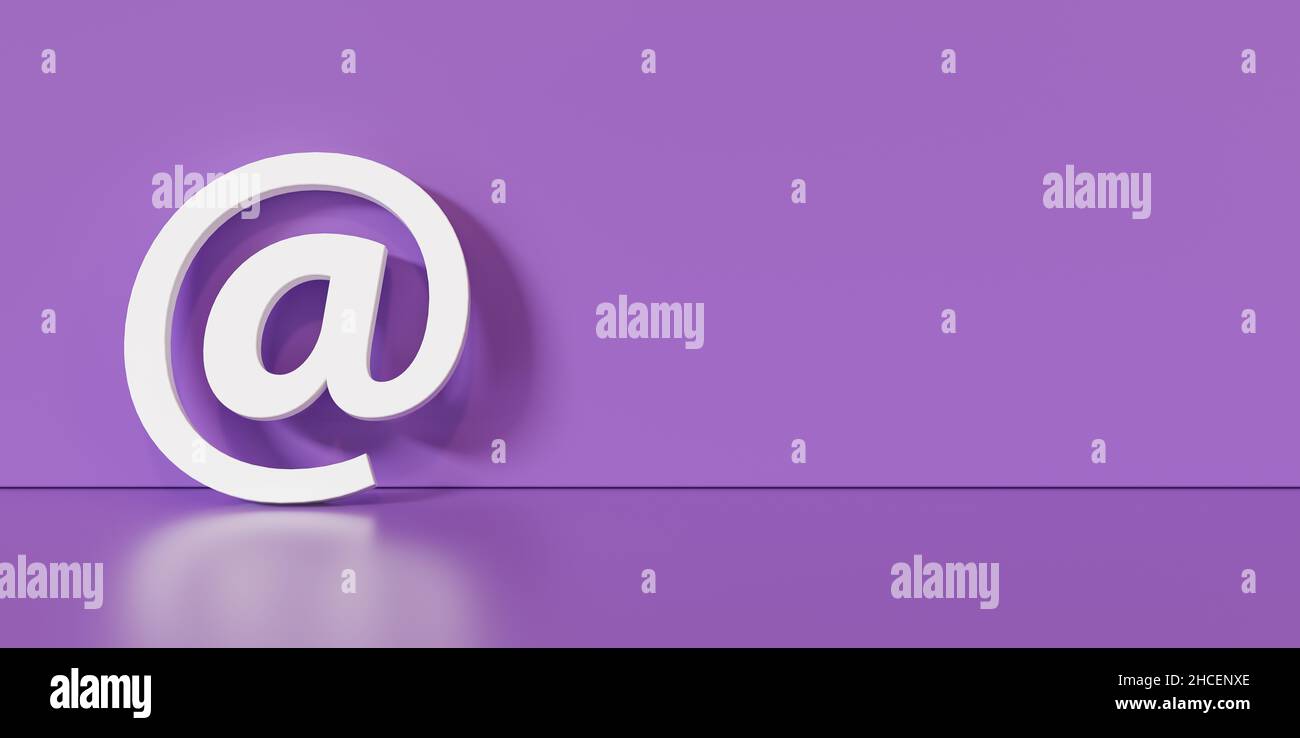 Email Icon or at sign leaning against a purple wall as a communication ...