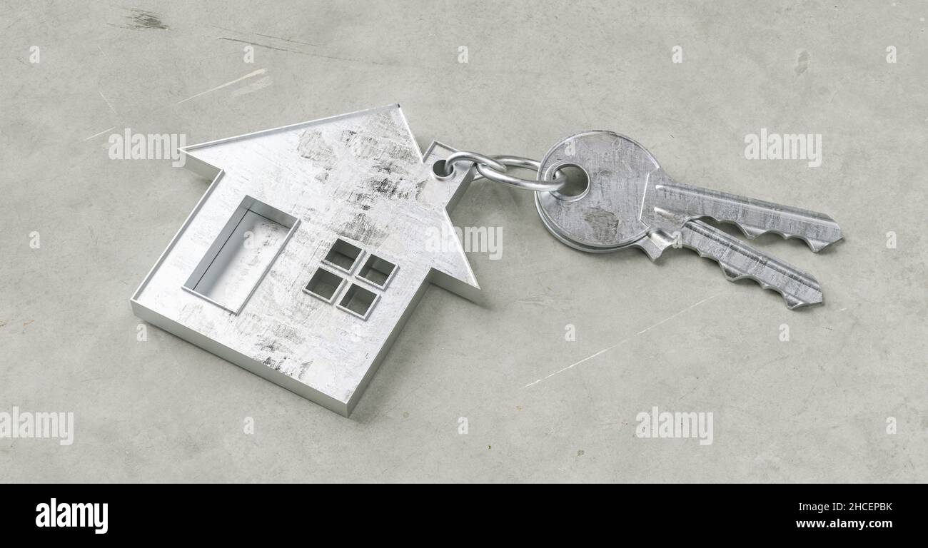 Keys with house shaped keychain on a concrete ground floor as a house ...