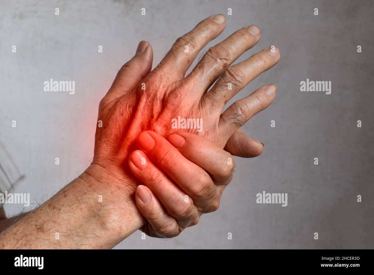 Pain in the hand of Southeast Asian elder man. Concept of hand pain ...
