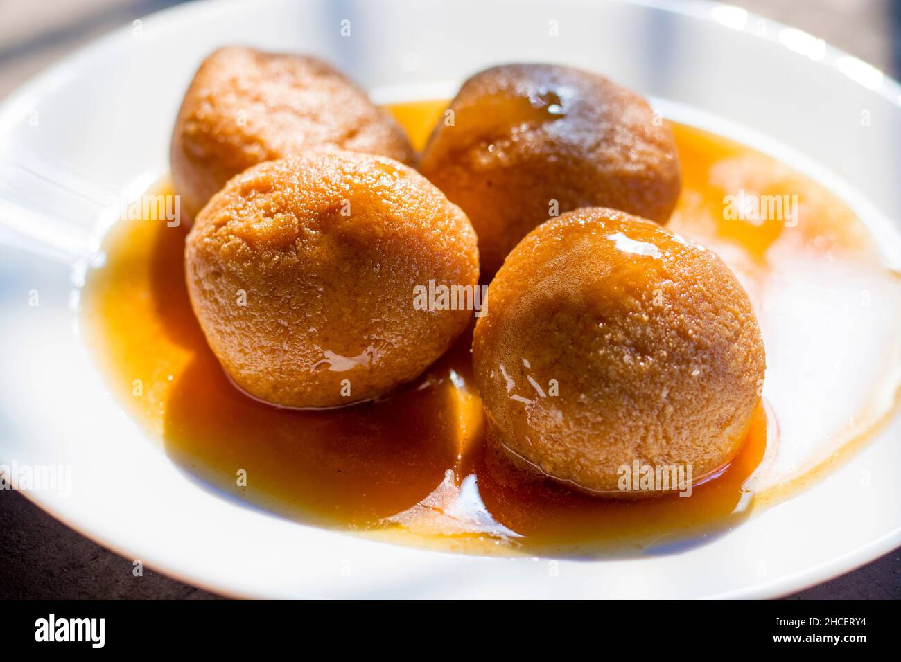 sugar filled roll, commonly known as "Rasgulla" or " Nolen Gurer ...