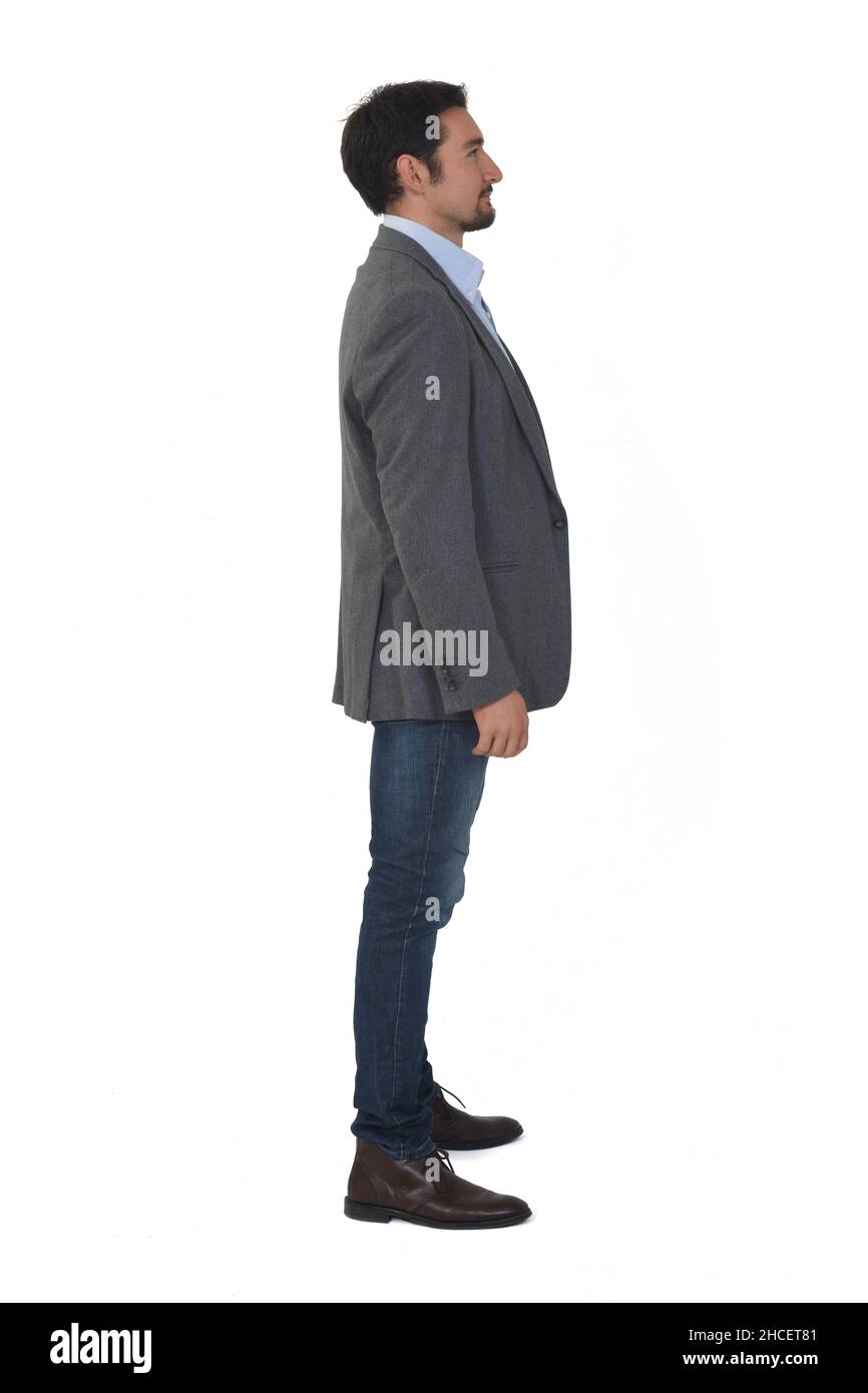 side view of a man with blazer and jeans on white background Stock ...
