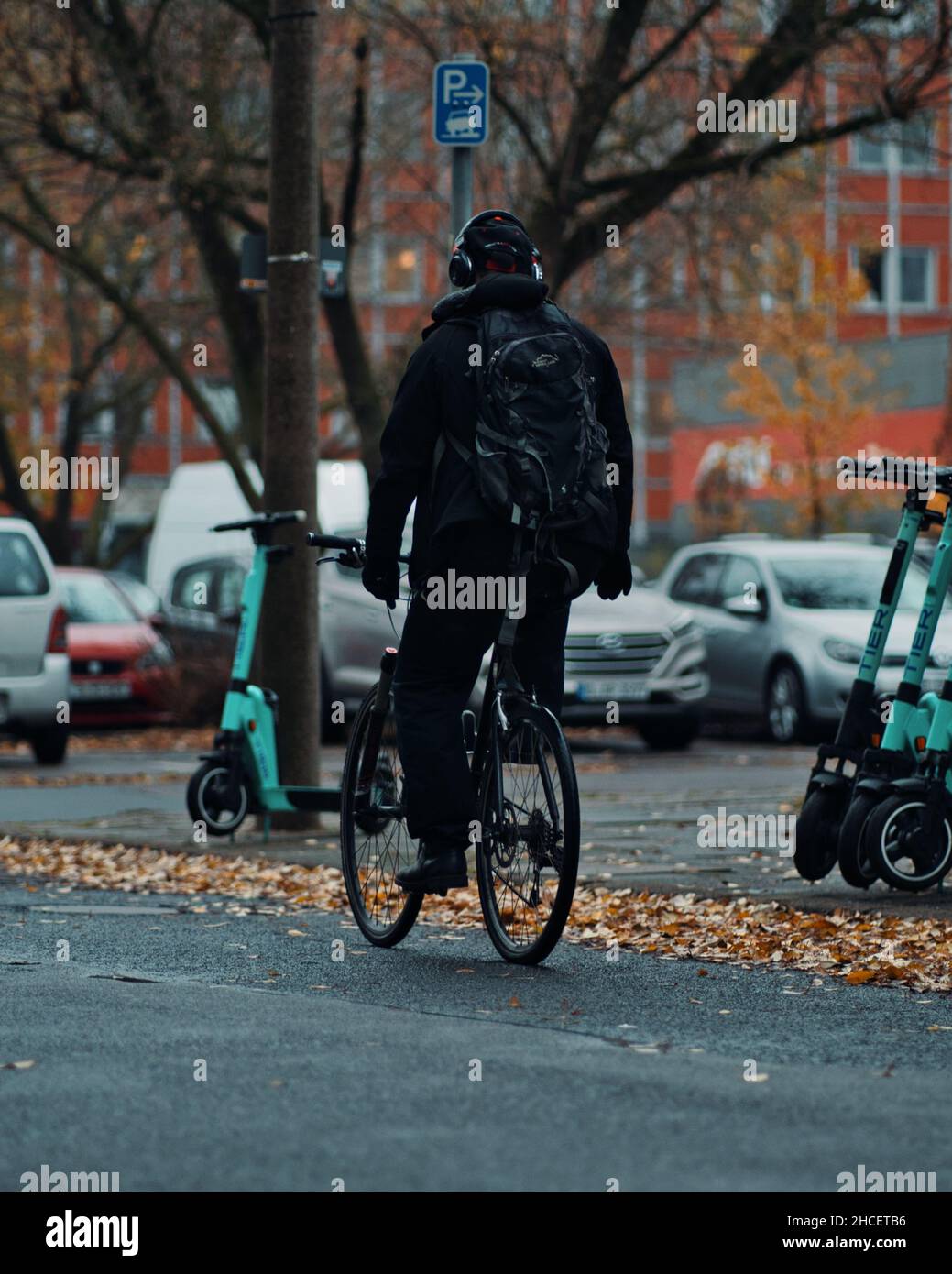 Vertical shot of the cyclist on the street in autumn Stock Photo - Alamy