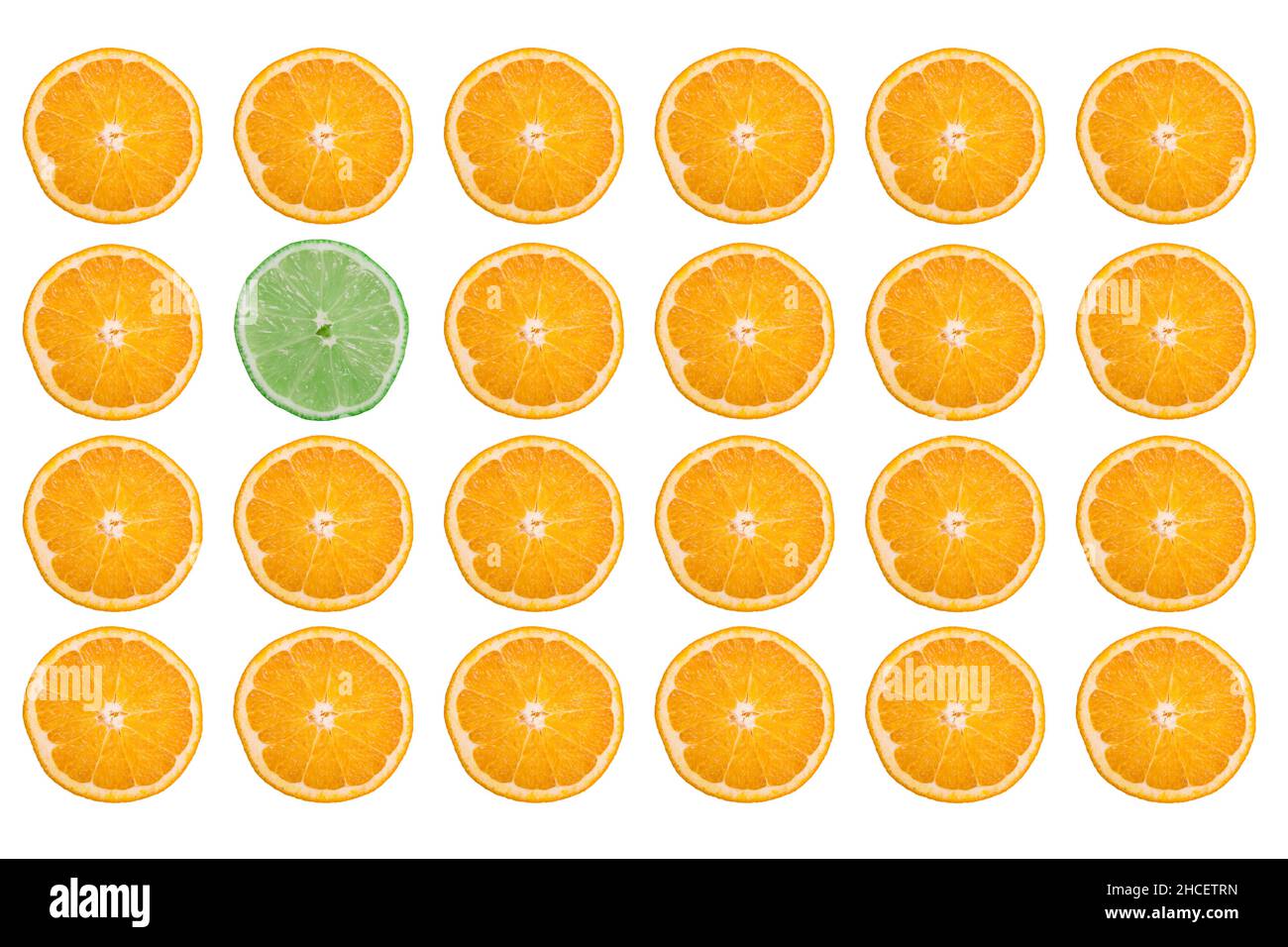 Rows of orange slices and only one lime slice isolated on a white ...