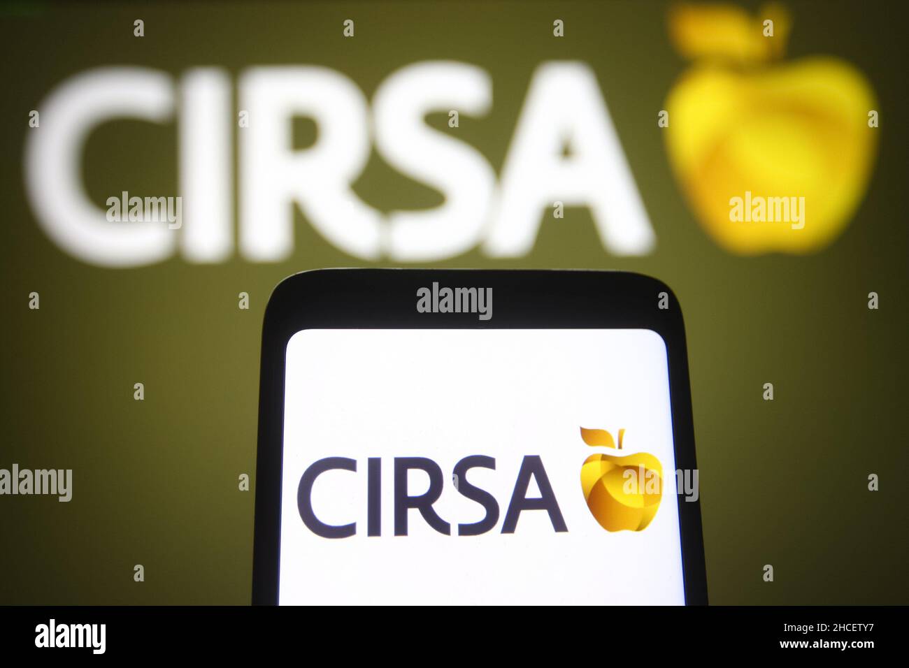 In this photo illustration, Cirsa logo is seen on a smartphone and in ...