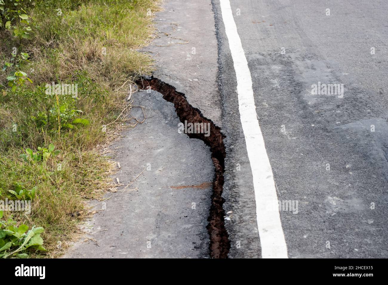 Broken asphalt road in the hillside due to earthquake Stock Photo - Alamy