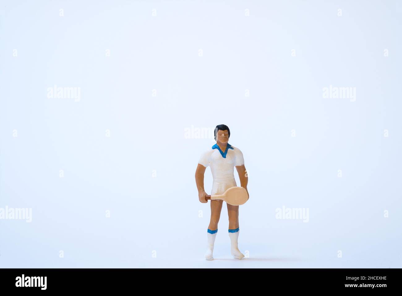 Miniature tennis athlete with tennis racket on a white background Stock ...