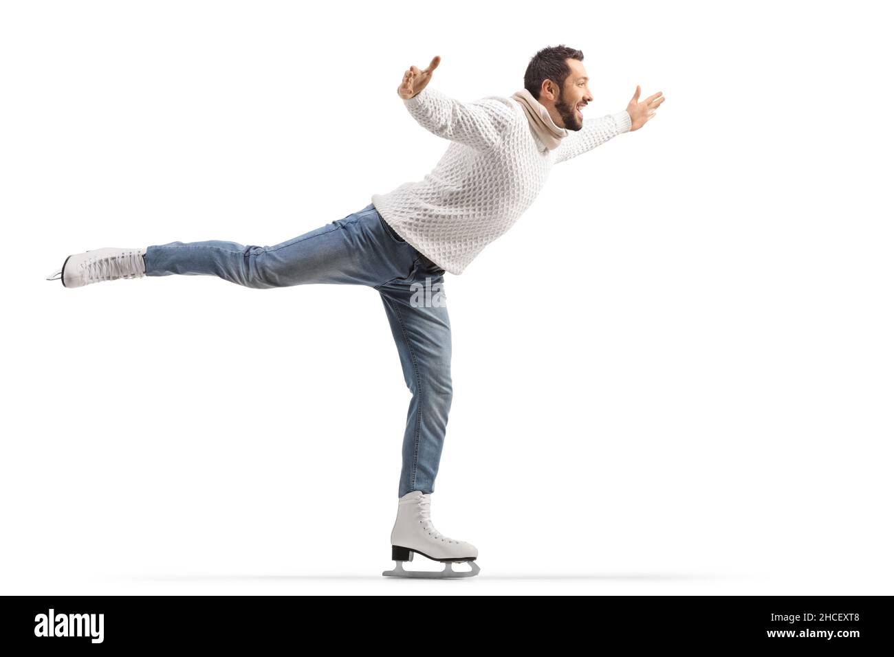 Full length profile shot of a man in jeans and white knitwear ...