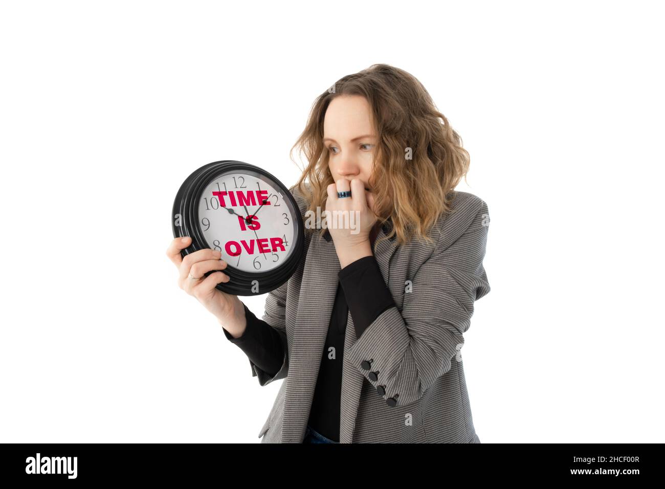 Time is over - the inscription on the clock. The woman clutched her ...