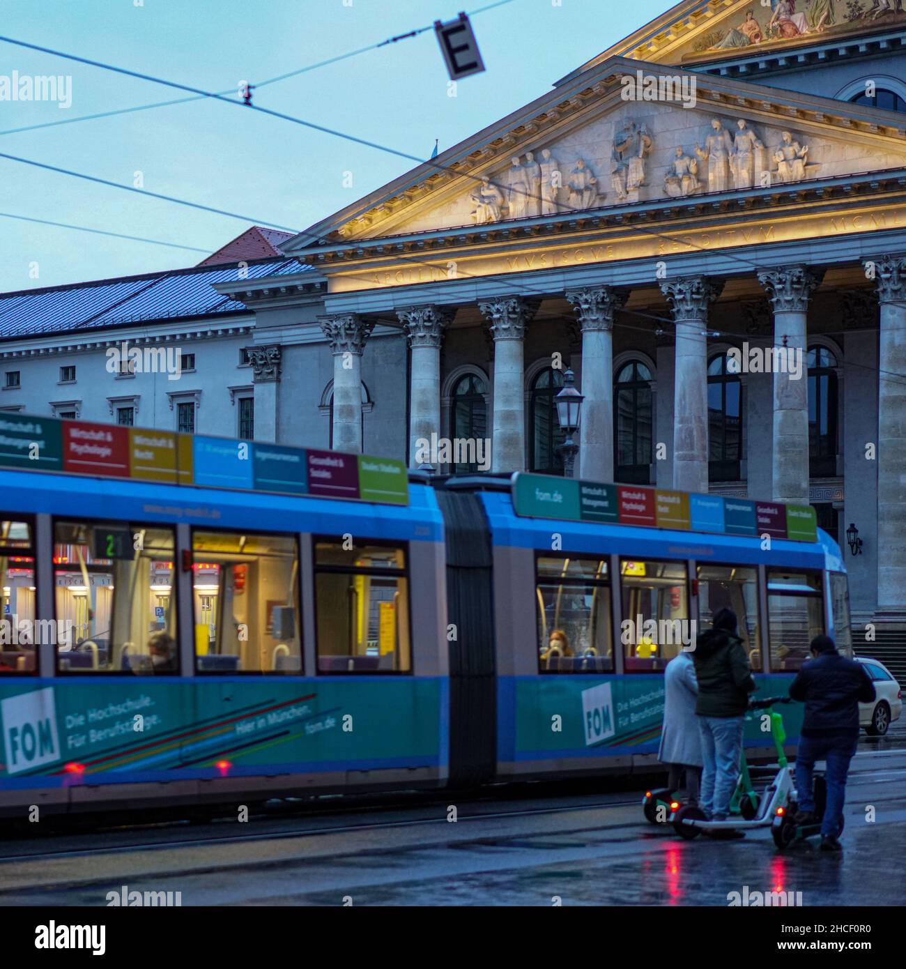 A tram in Munich in the evening hours with a view of the Bavarian State ...