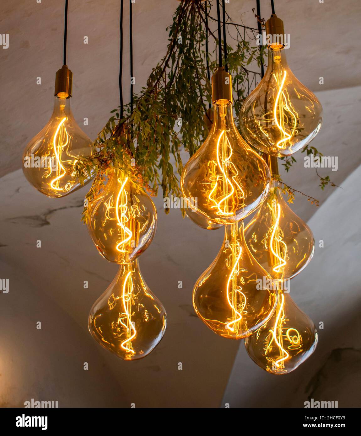 Lightbulbs hanging from ceiling hi-res stock photography and images - Alamy