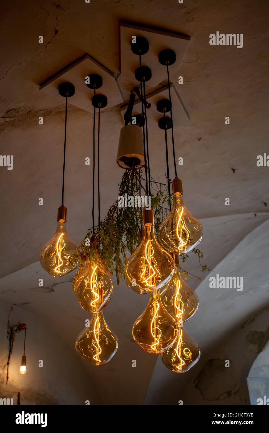 Decorative antique edison style filament light bulbs hanging from the ...