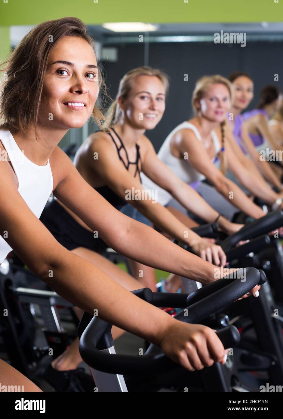 women on cardio training on exercycles in health club Stock Photo - Alamy