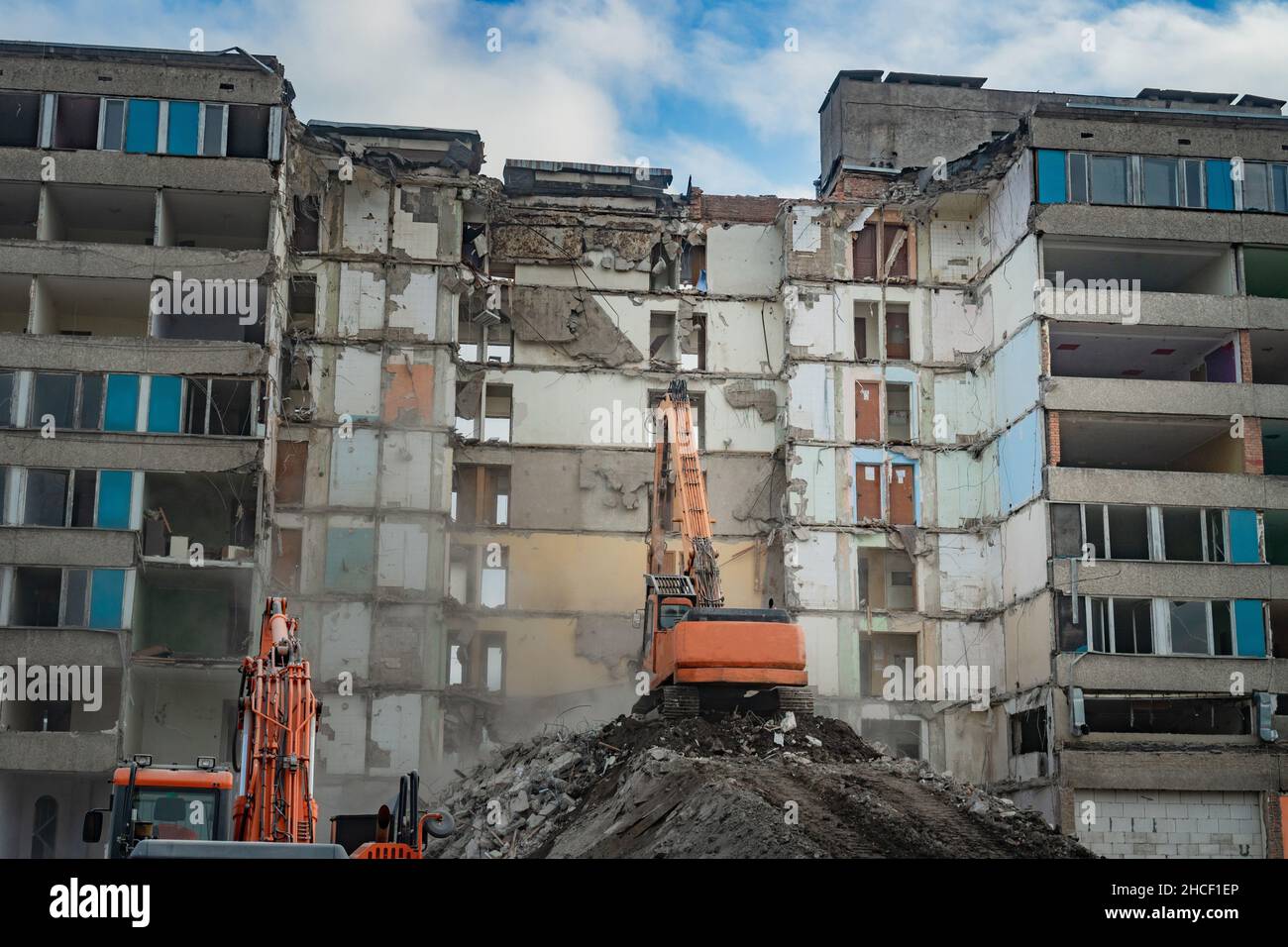 Dismantling the building with an excavator.Destruction of an old ...