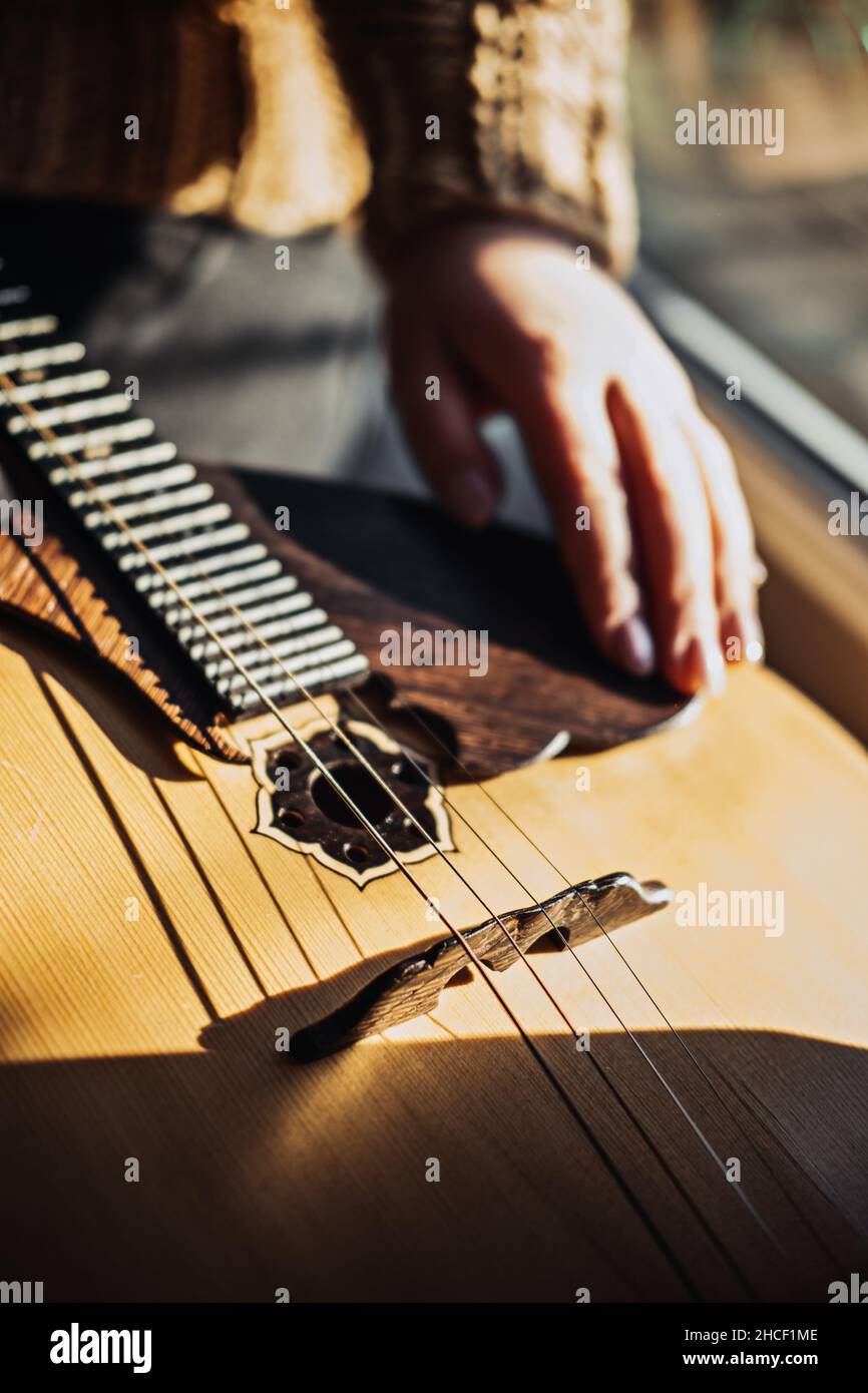 Domra Folk Musical Instrument. Female hands with 4 strings Natural Wood ...