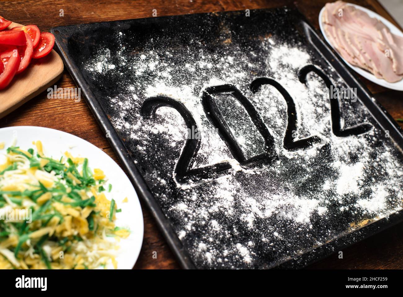 2022 numbers on flour on a baking sheet. New year culinary concept ...