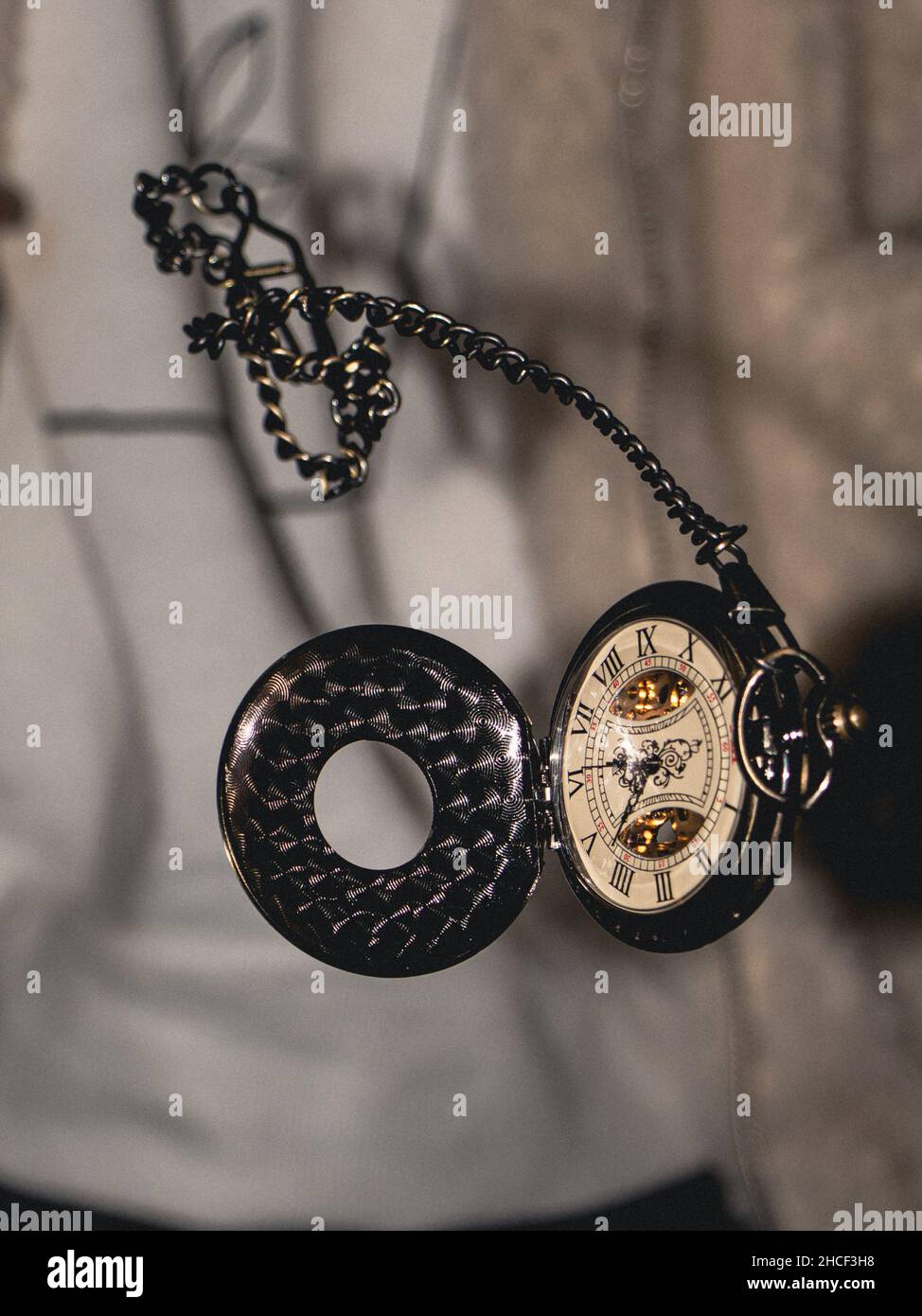 Stopwatch falling in mid-air on a blurred background Stock Photo - Alamy