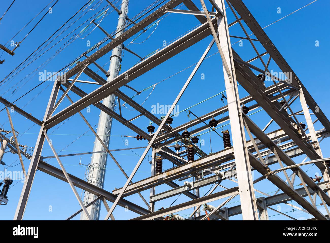 Electric power lines with brilliant blue skies in the background Stock ...