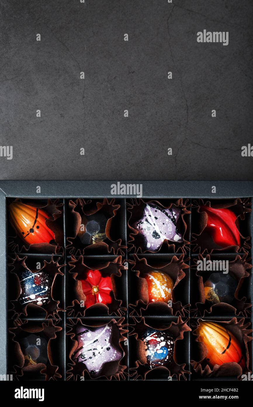 Handmade chocolates in a box. Production of confectionery products ...