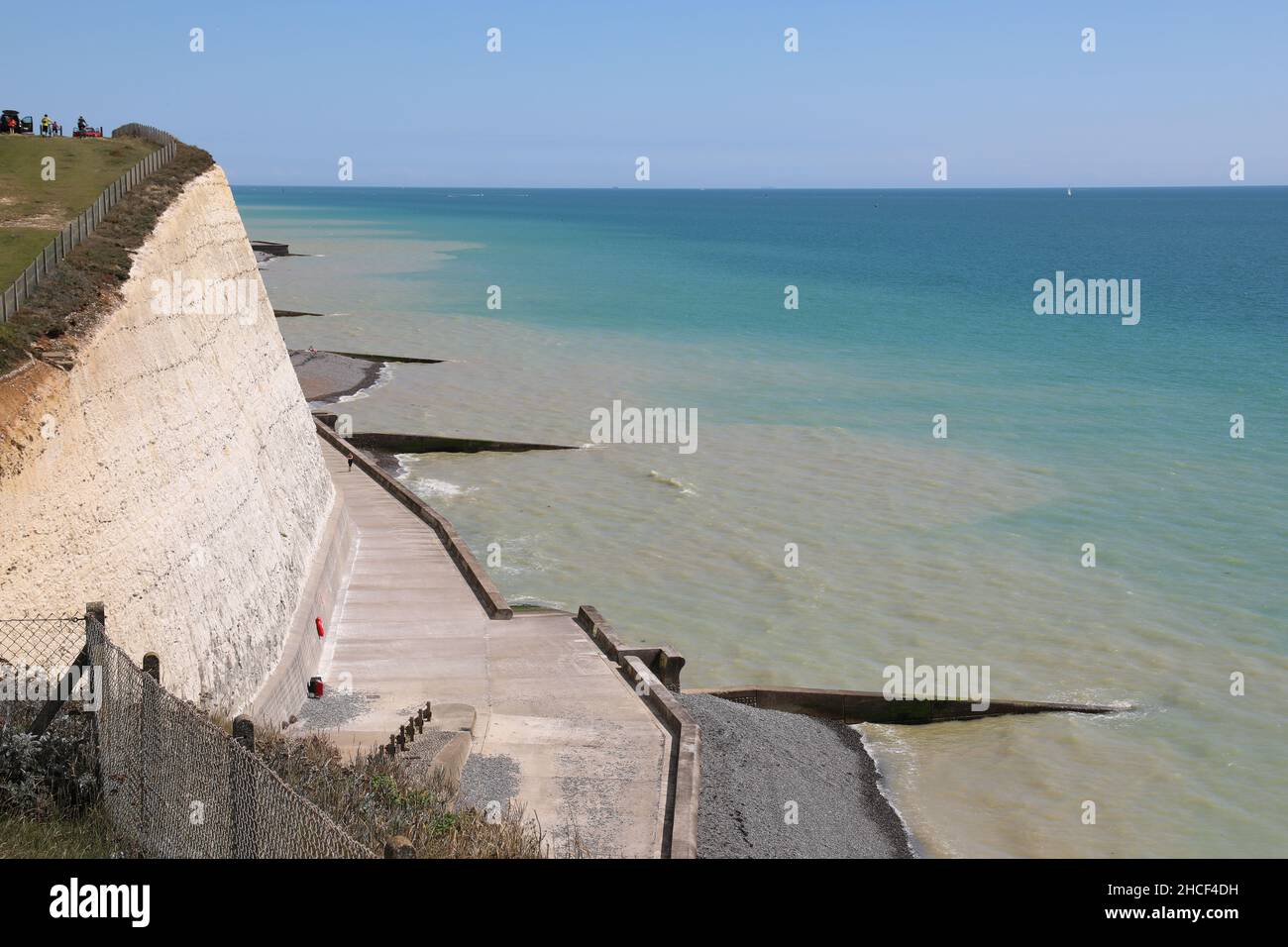 Aerial view of turquoise water waves calmly splashing on the coast in ...