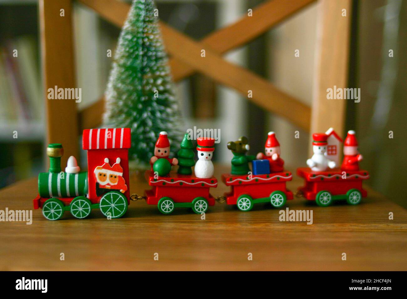 Christmas toy train with wagons on a wooden table Stock Photo - Alamy