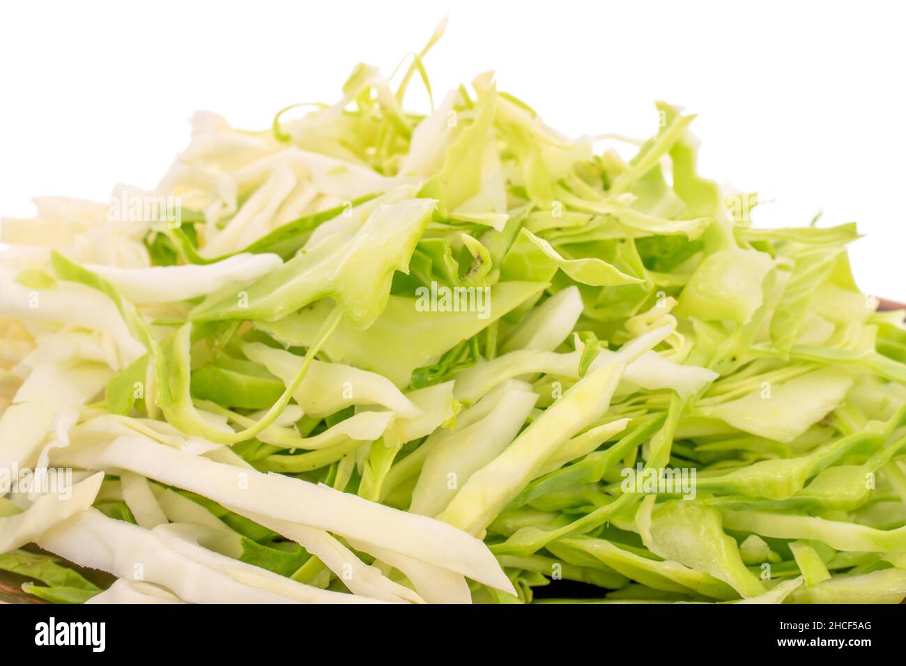 Fresh shredded white cabbage, close-up, isolated on white Stock Photo ...