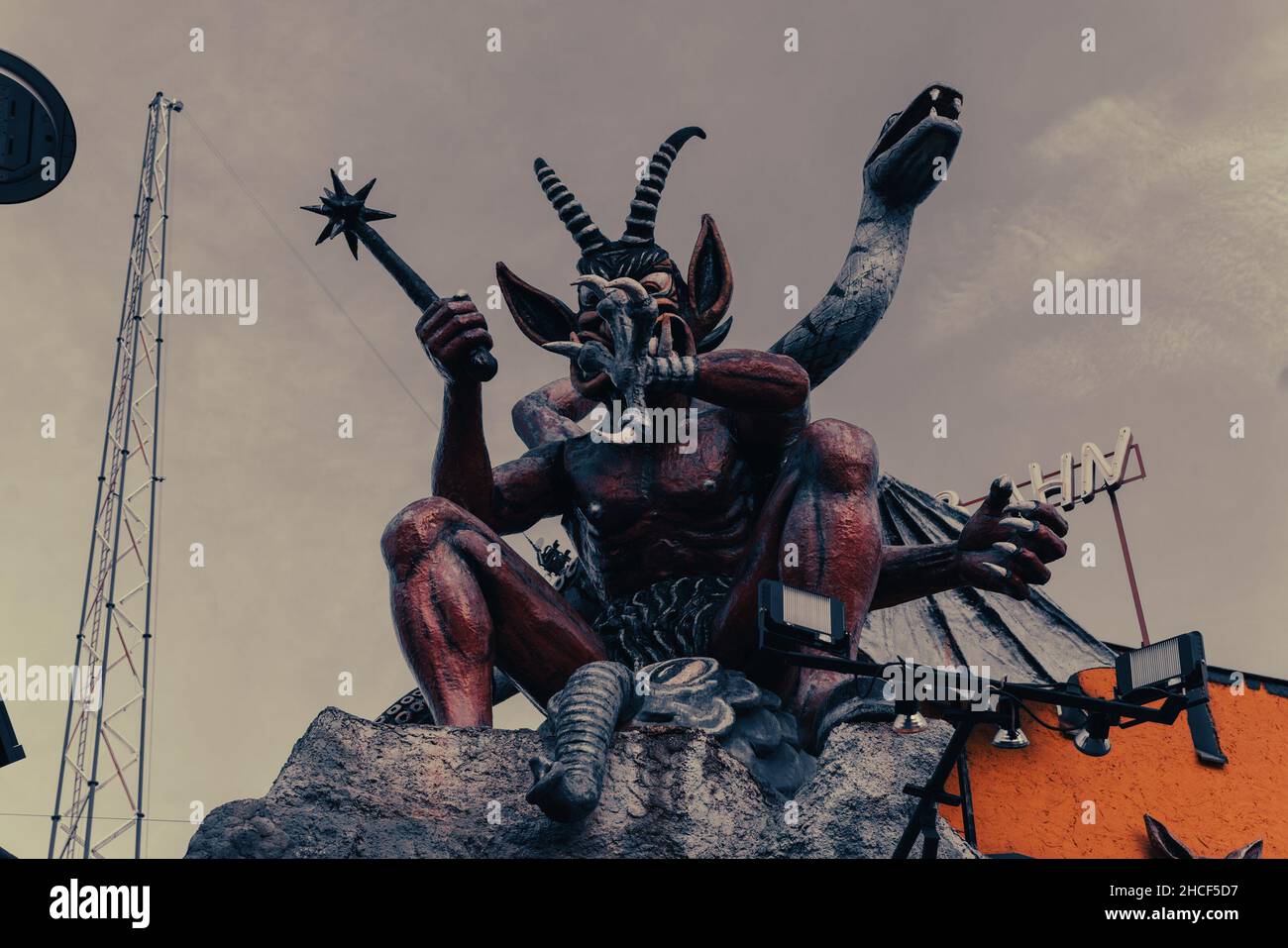 Statue of the devil in Vienna Prater Stock Photo - Alamy