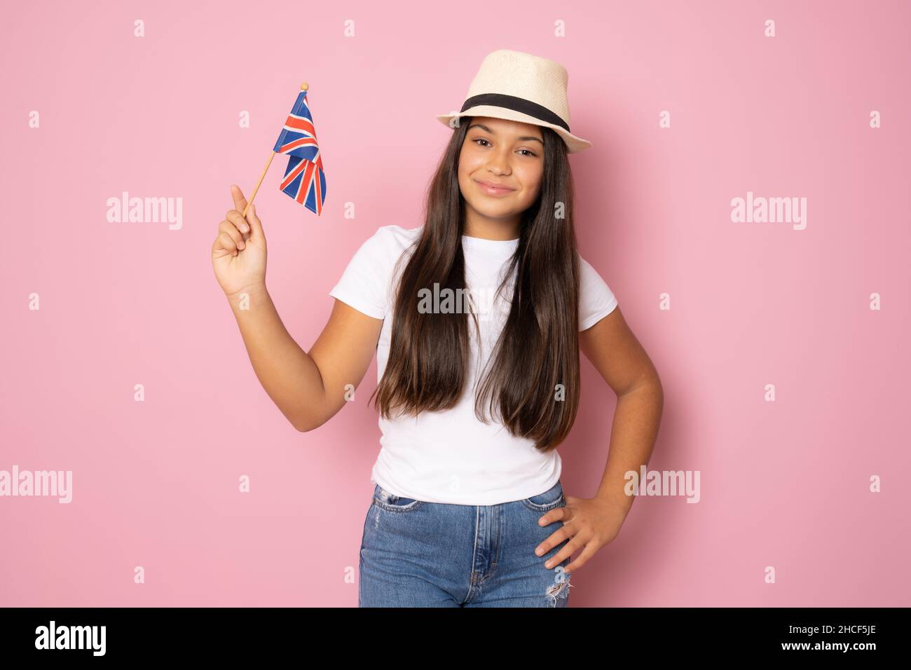 Education abroad. Female student holding uk British flag and smiling ...