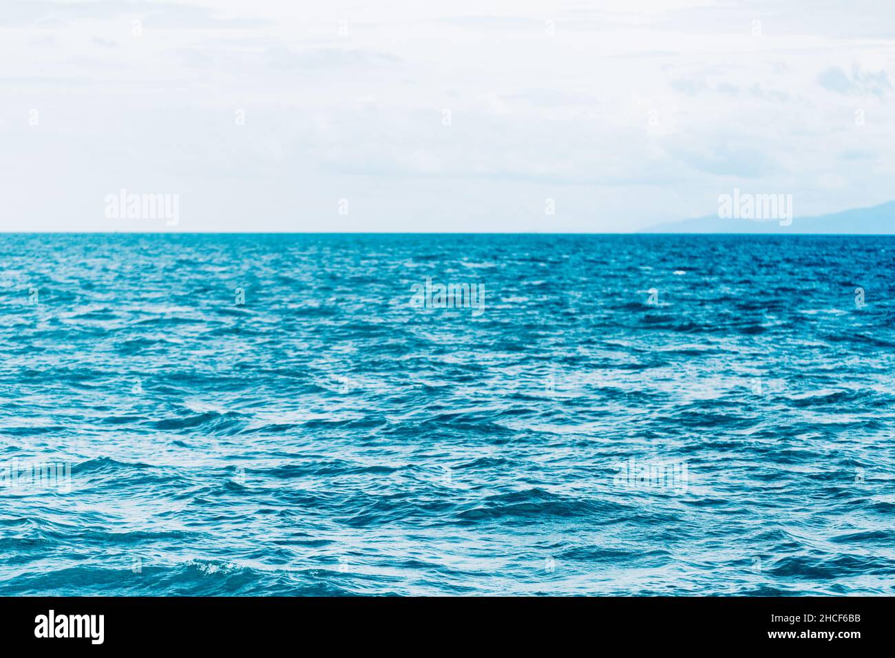 Bright Blue ocean with smooth wave background Stock Photo - Alamy