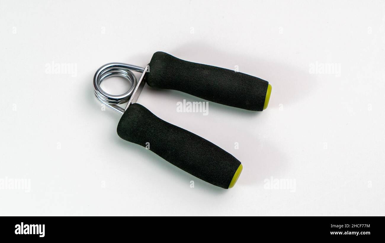 Closeup shot of a hand exercise clamp isolated on a white background ...