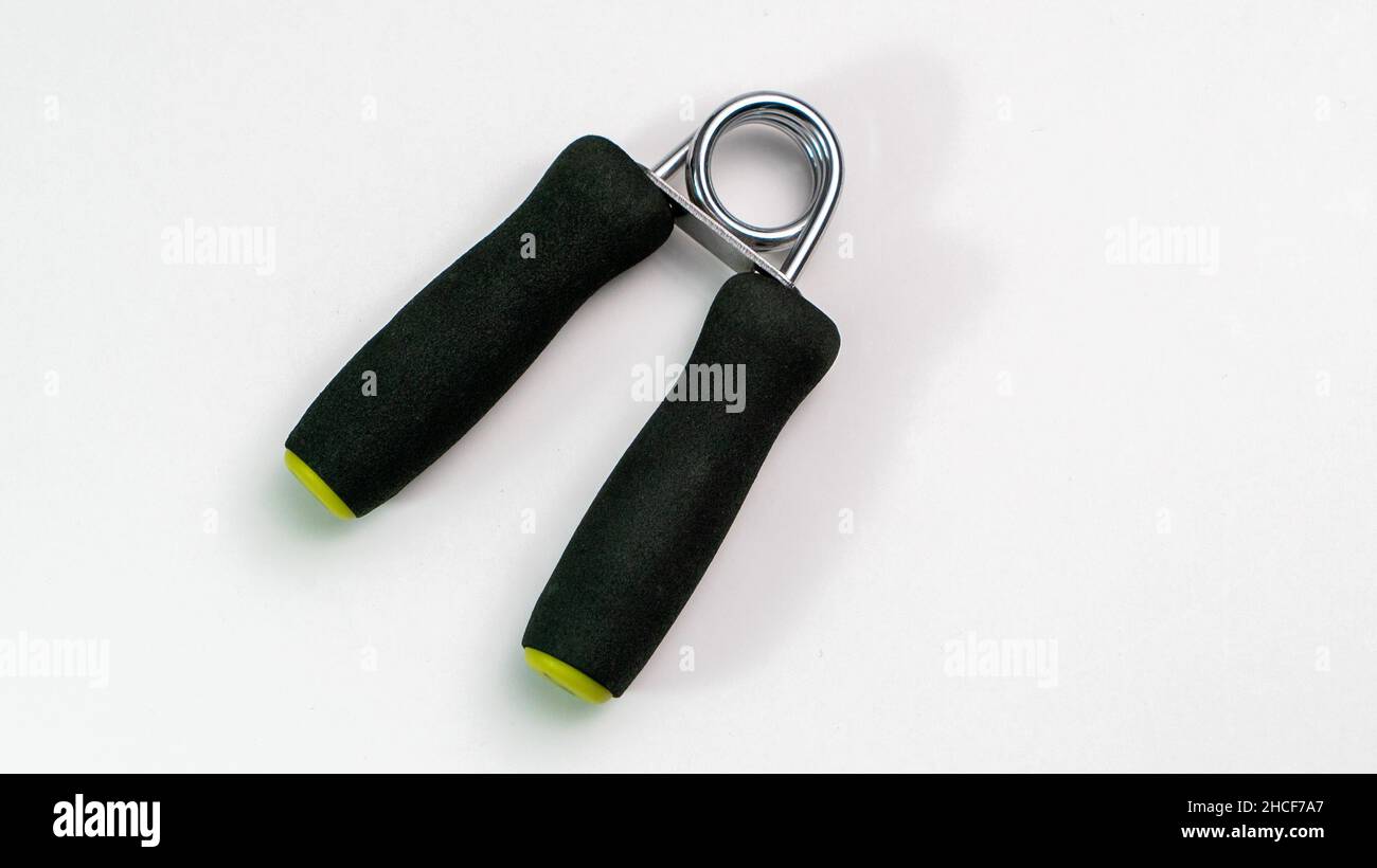 Closeup shot of a hand exercise clamp isolated on a white background ...