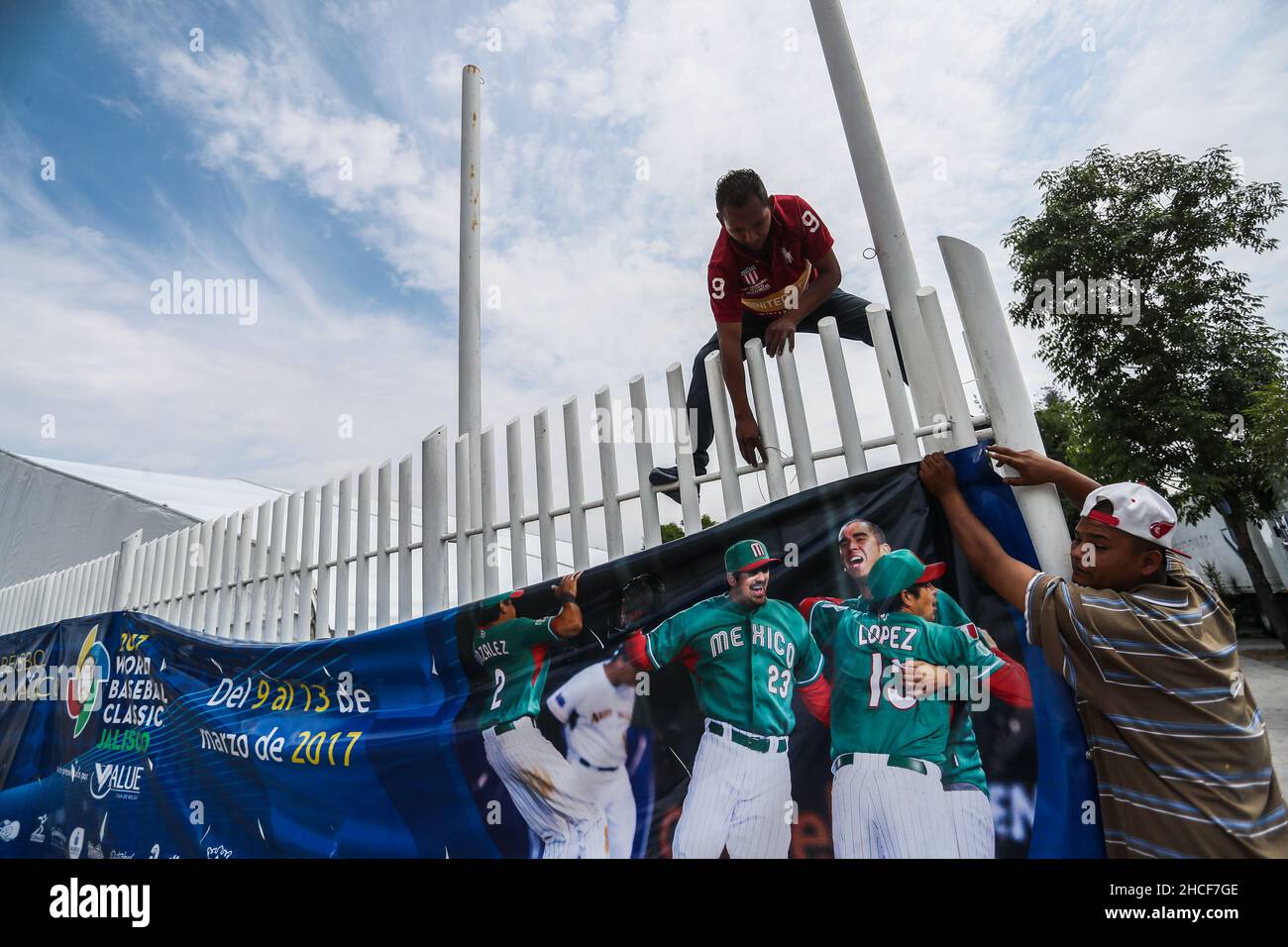 People post the image of the Mexican team for the fan fest outside the ...
