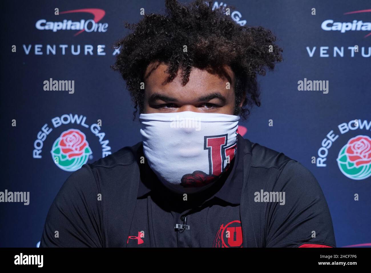 Utah Utes offensive lineman Nick Ford wears a face mask at a press ...